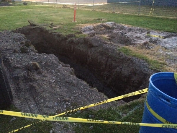 Excavator accident causes fire when it hits an overhead power line.